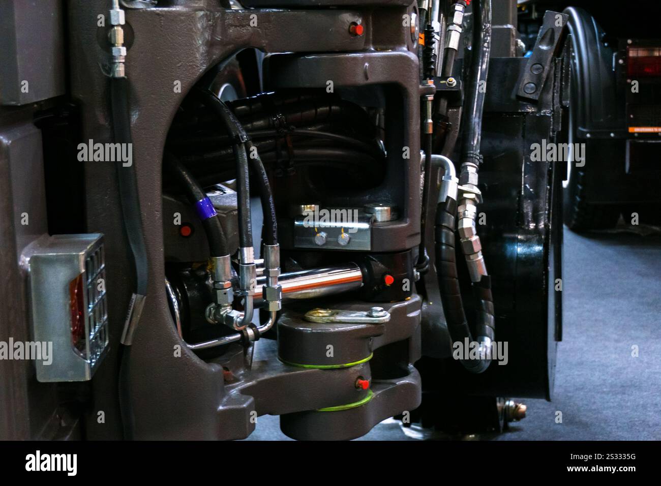 A detailed close-up of the hydraulic system and mechanical connections ...