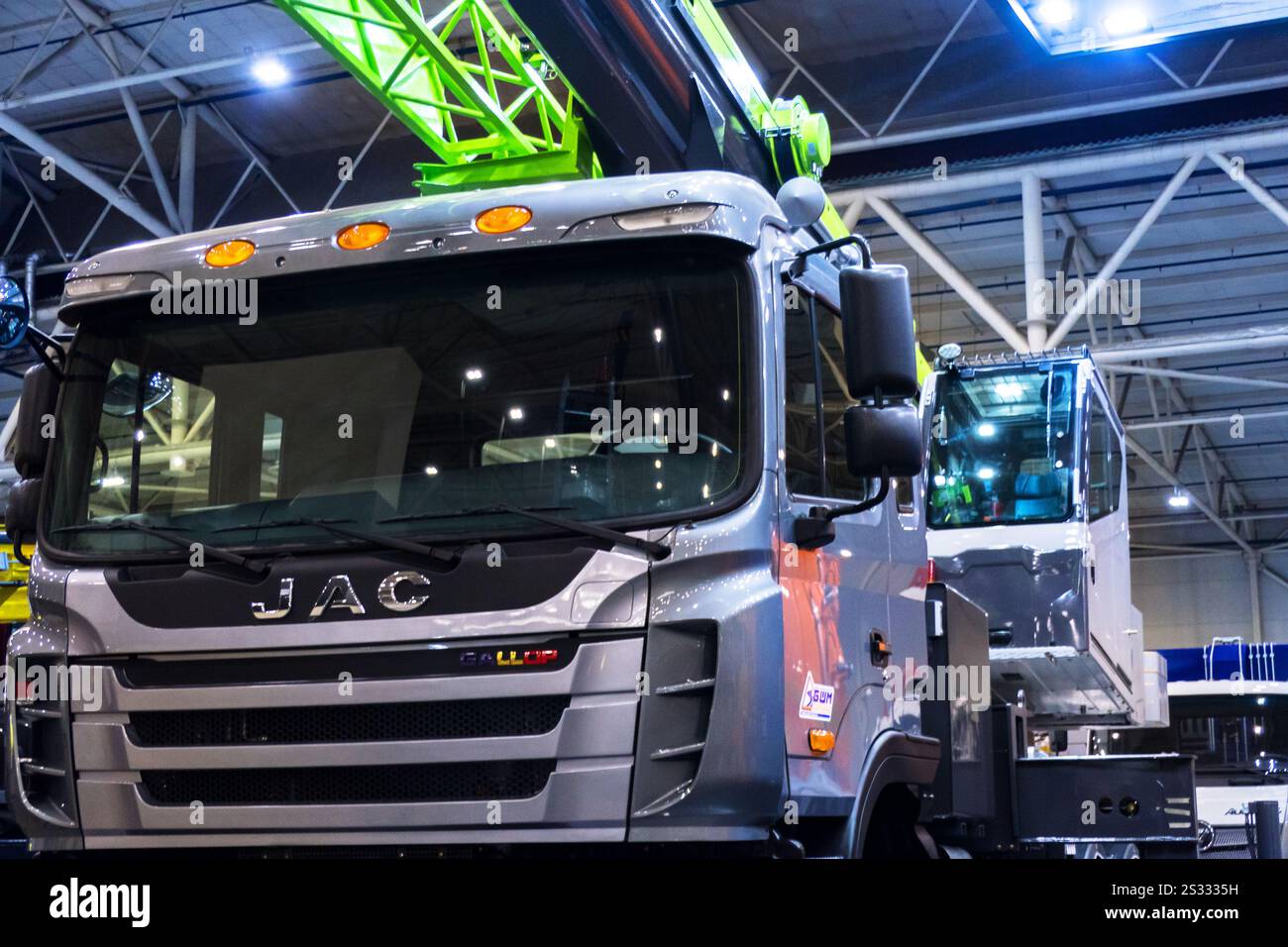 The image shows the front view of a JAC truck crane, specifically the ...