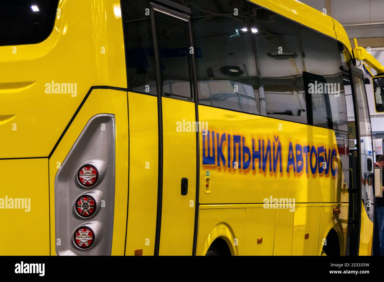 A bright yellow bus with the words School Bus written in Ukrainian on ...