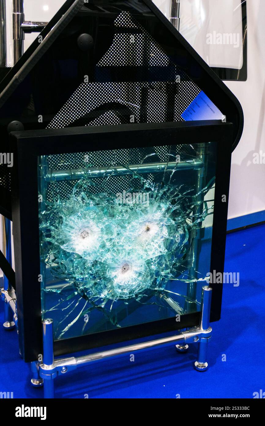 A close-up of bulletproof glass being tested for strength, with visible ...