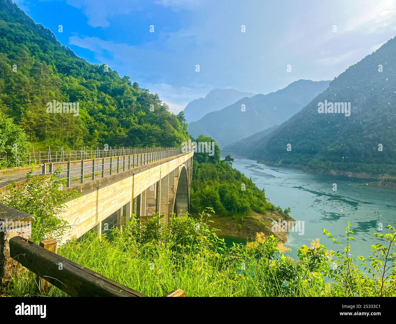 Valvestino lake and Recchi bridge on summer rainy day, Italy Stock ...