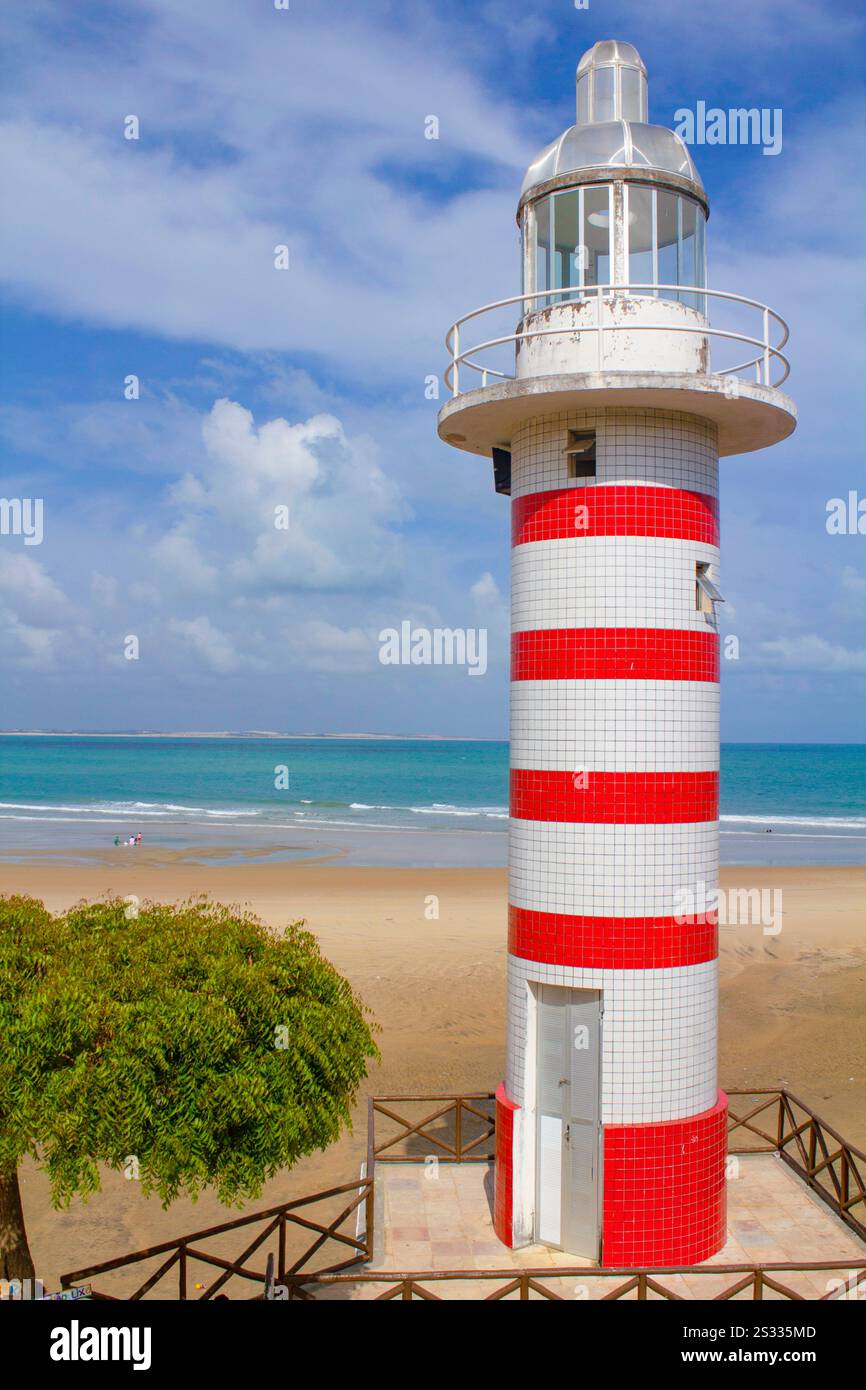 Red and white striped lighthouse on the beach Stock Photo - Alamy