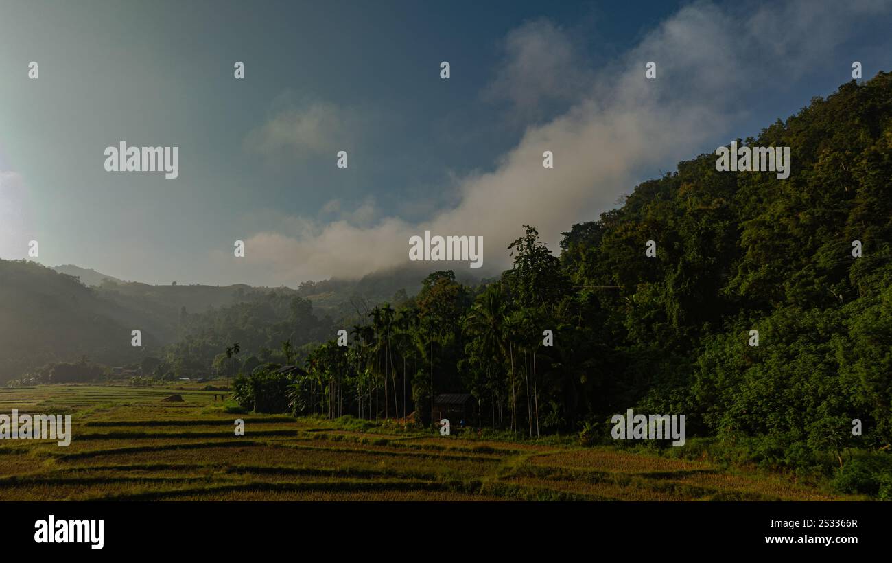 Aerial view of the sun above The sun over the mountain peaks shines ...