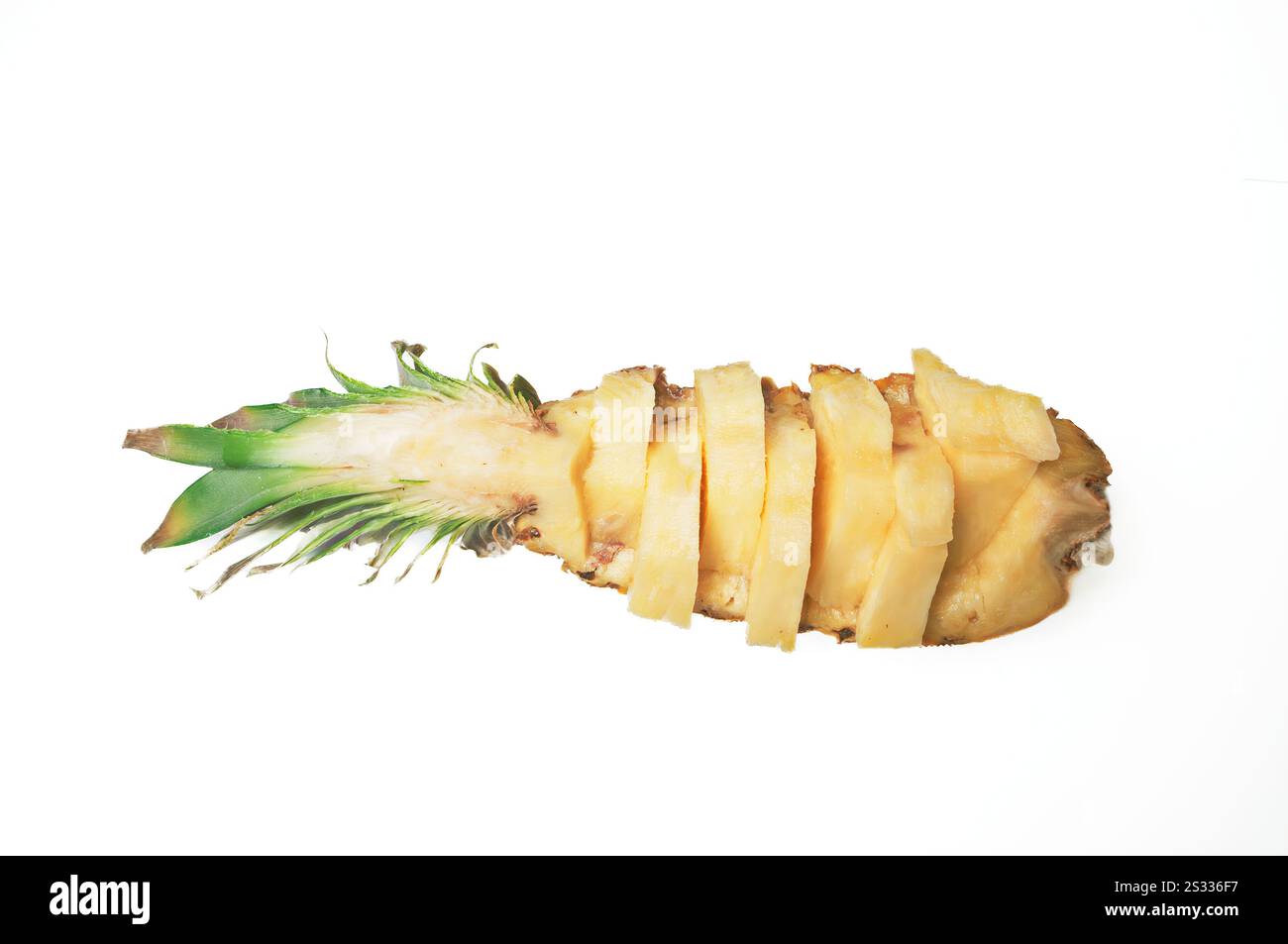An organic pineapple cut into pieces ready for consumption Stock Photo ...