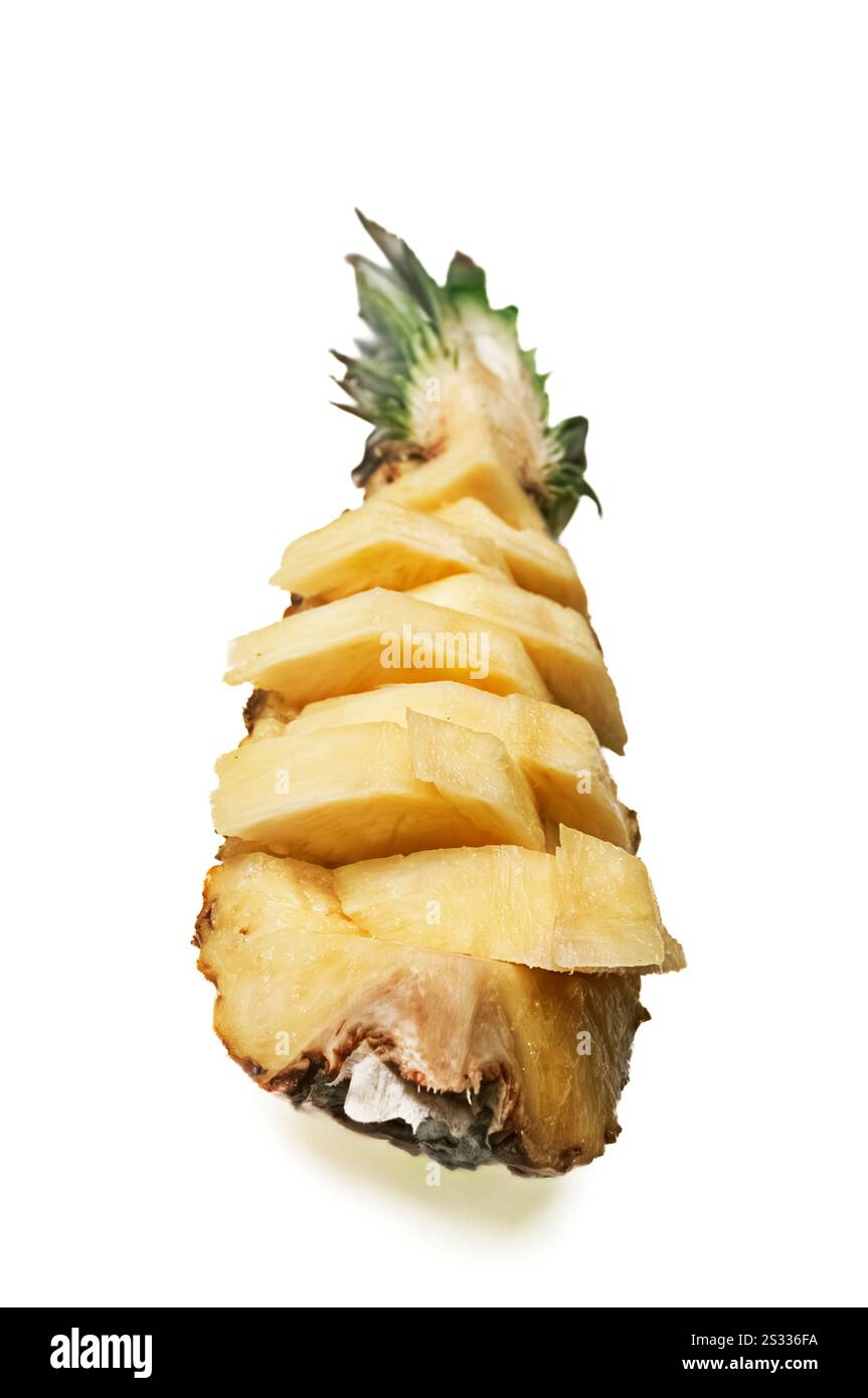 An organic pineapple cut into pieces ready for consumption Stock Photo ...