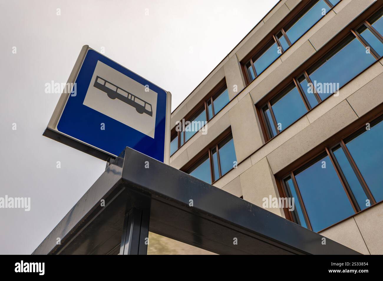 Public transport, a sign informing about a bus stop in a modern housing ...