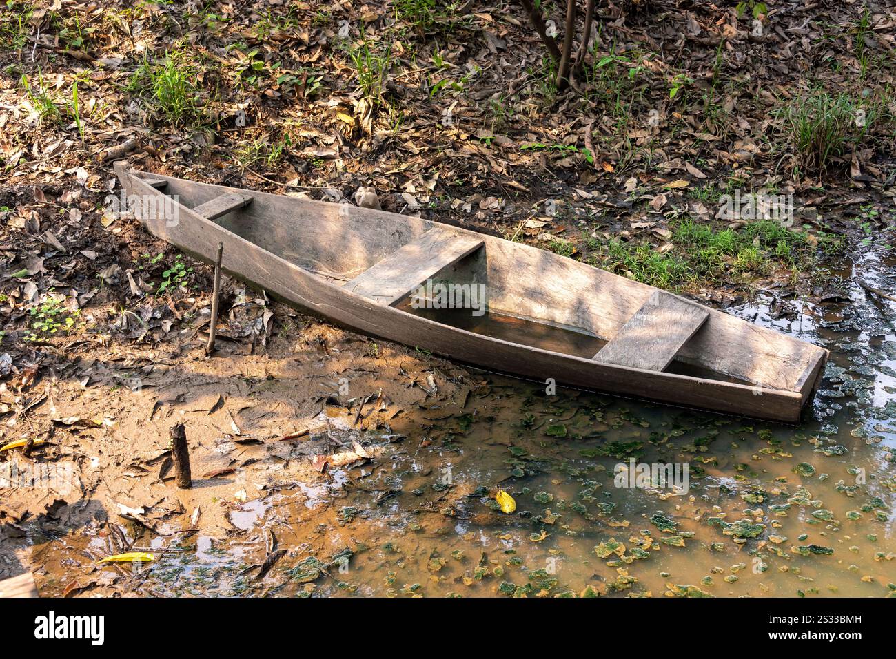 Wooden conoe waiting to be used. San Antonio del Cacao Island, Amazonas ...