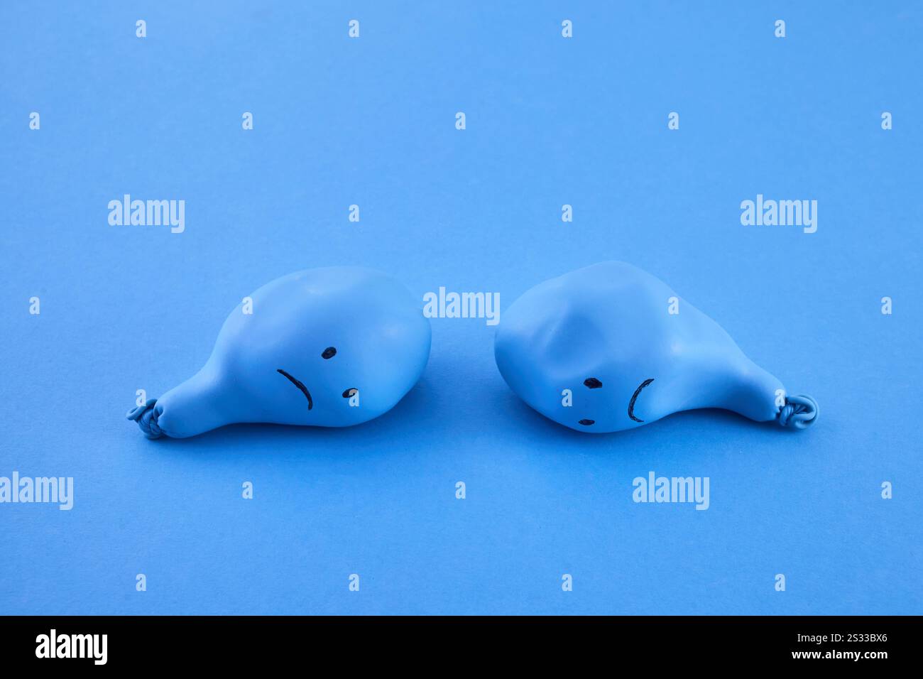 Blue Monday Mood. A deflated balloon with a sad face Stock Photo - Alamy
