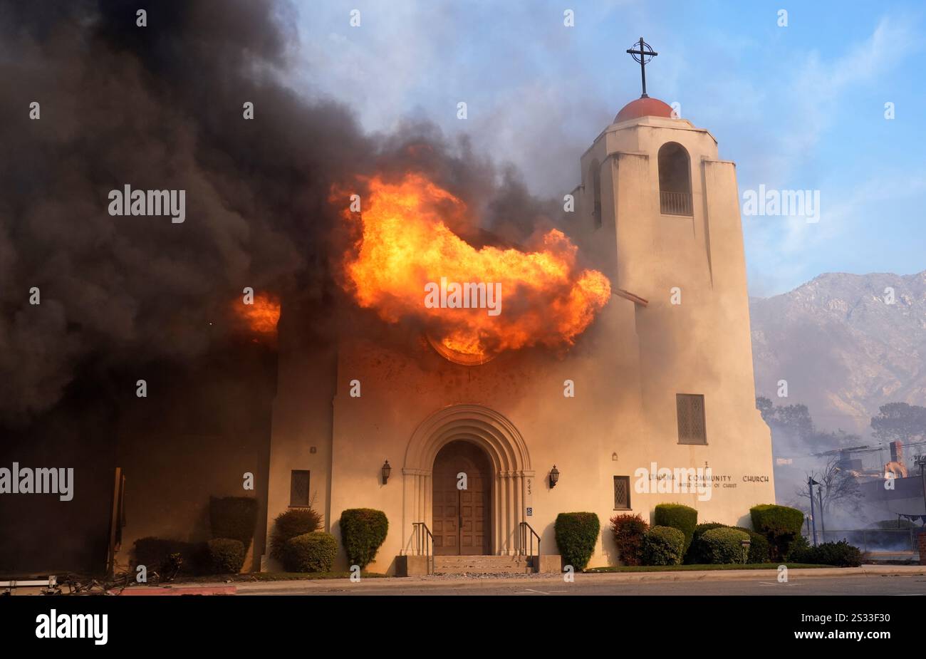 Fire explodes out of a window of the Altadena Community Church ...