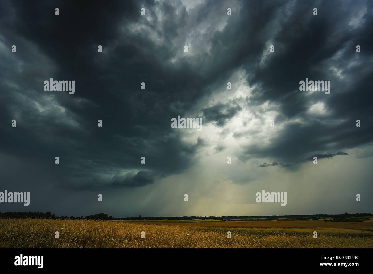 The dark sky with heavy clouds converging and a violent storm before ...