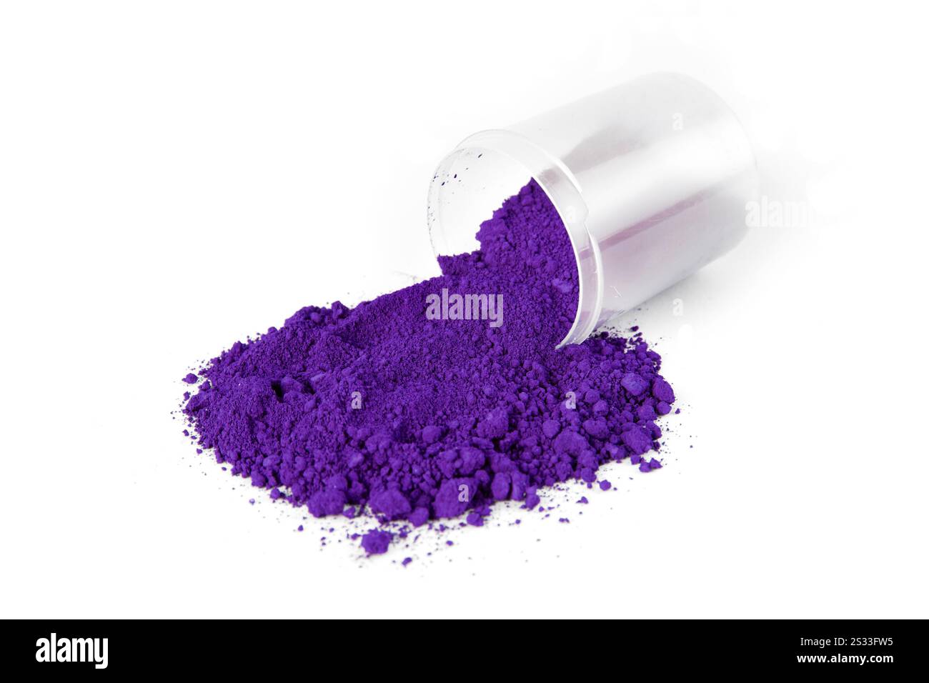 Bright purple powder is spilled from a transparent container, creating ...