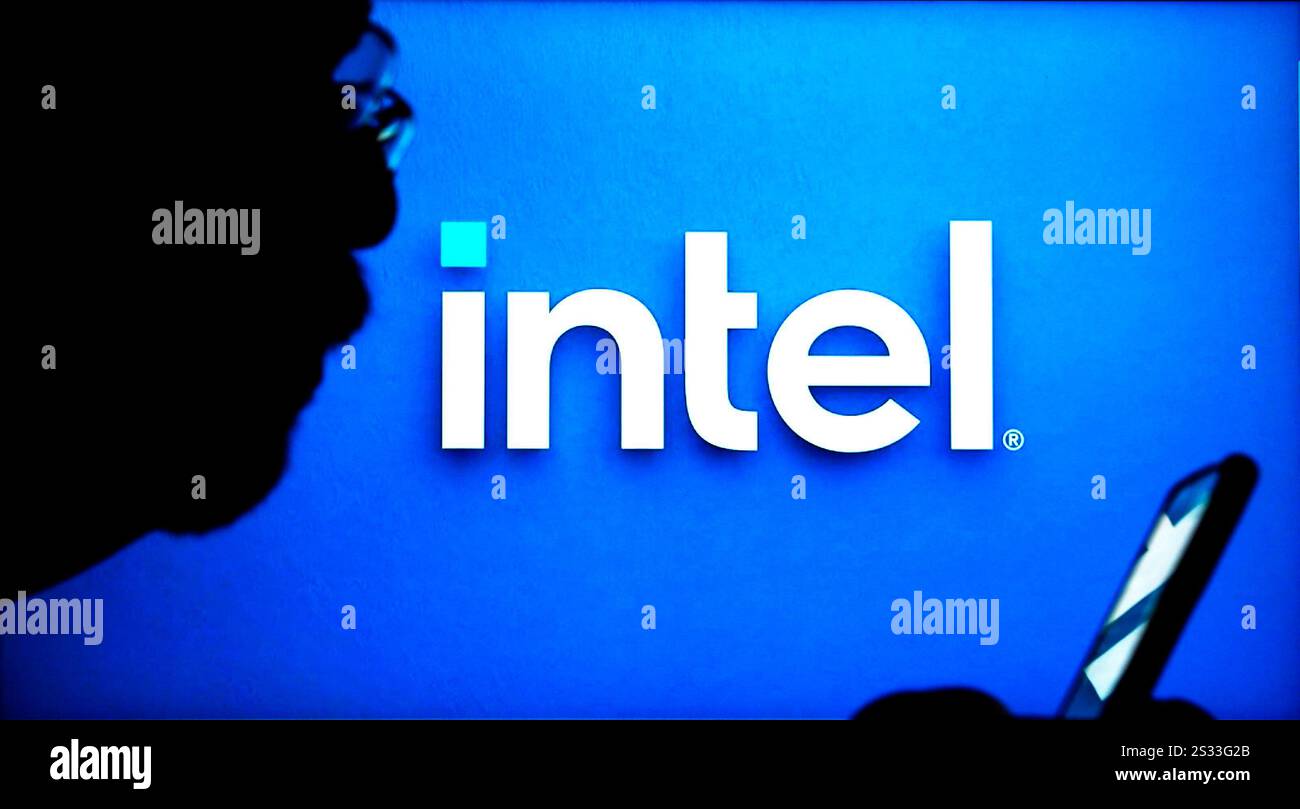 In this photo illustration, an Intel Corp logo seen displayed on a ...