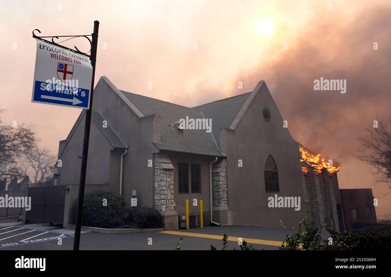 Flames rise out of St. Mark's Episcopal Church, Wednesday, Jan. 8, 2025 ...