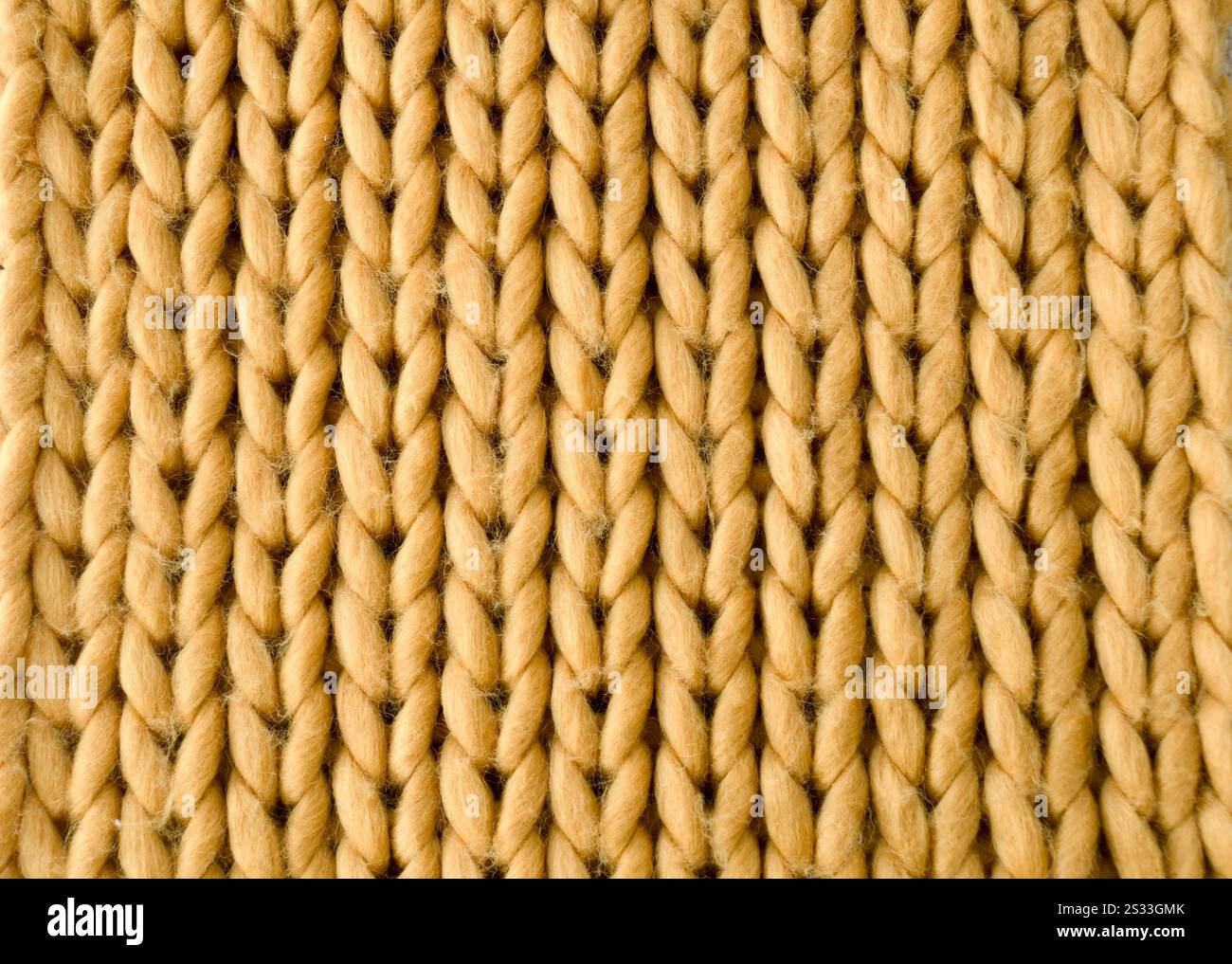 Knitting, sample from yellow yarn. Synthetic fibers, three-dimensional ...