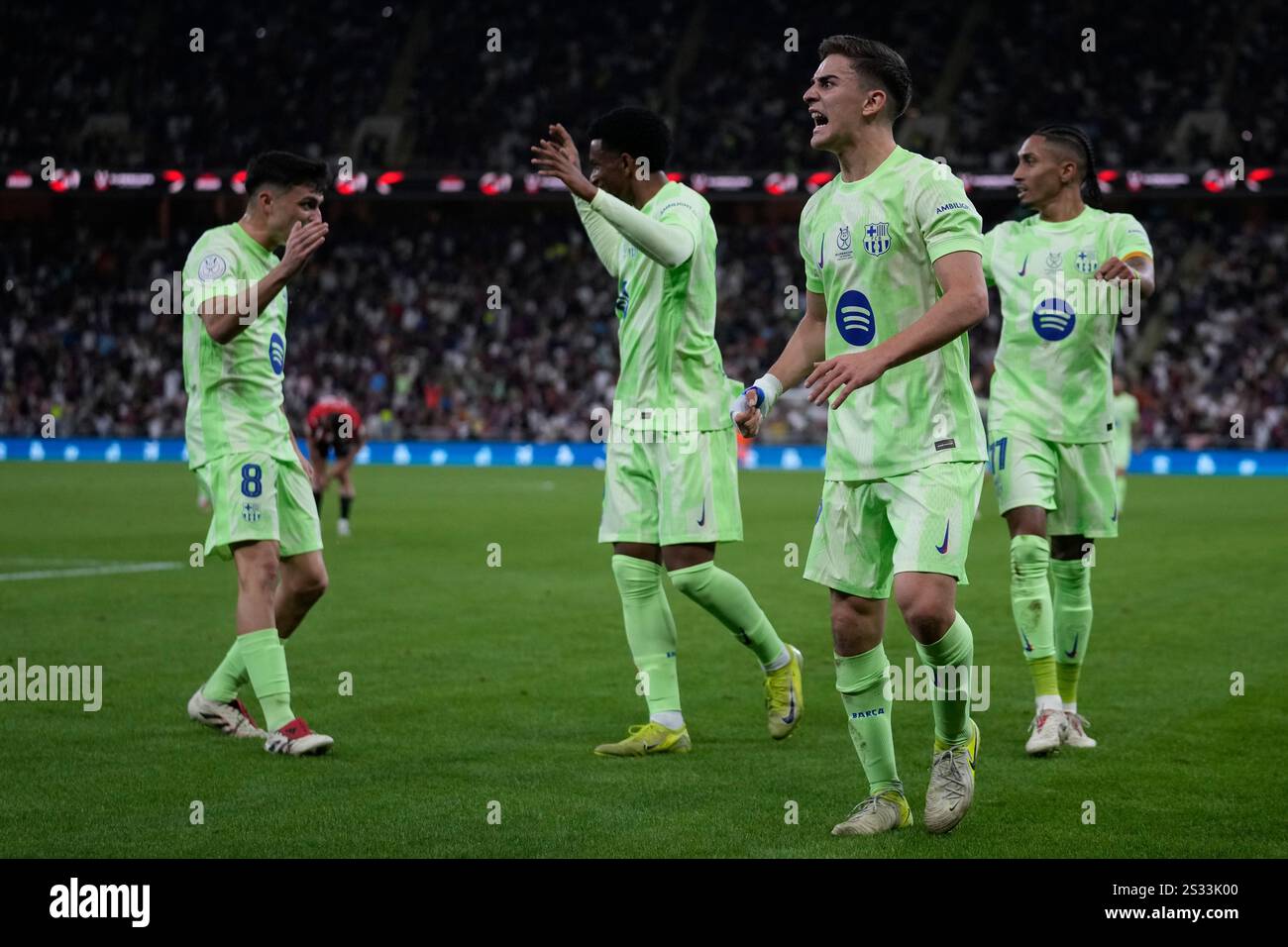 Barcelona's Gavi, front, celebrates after scoring during the Spanish ...