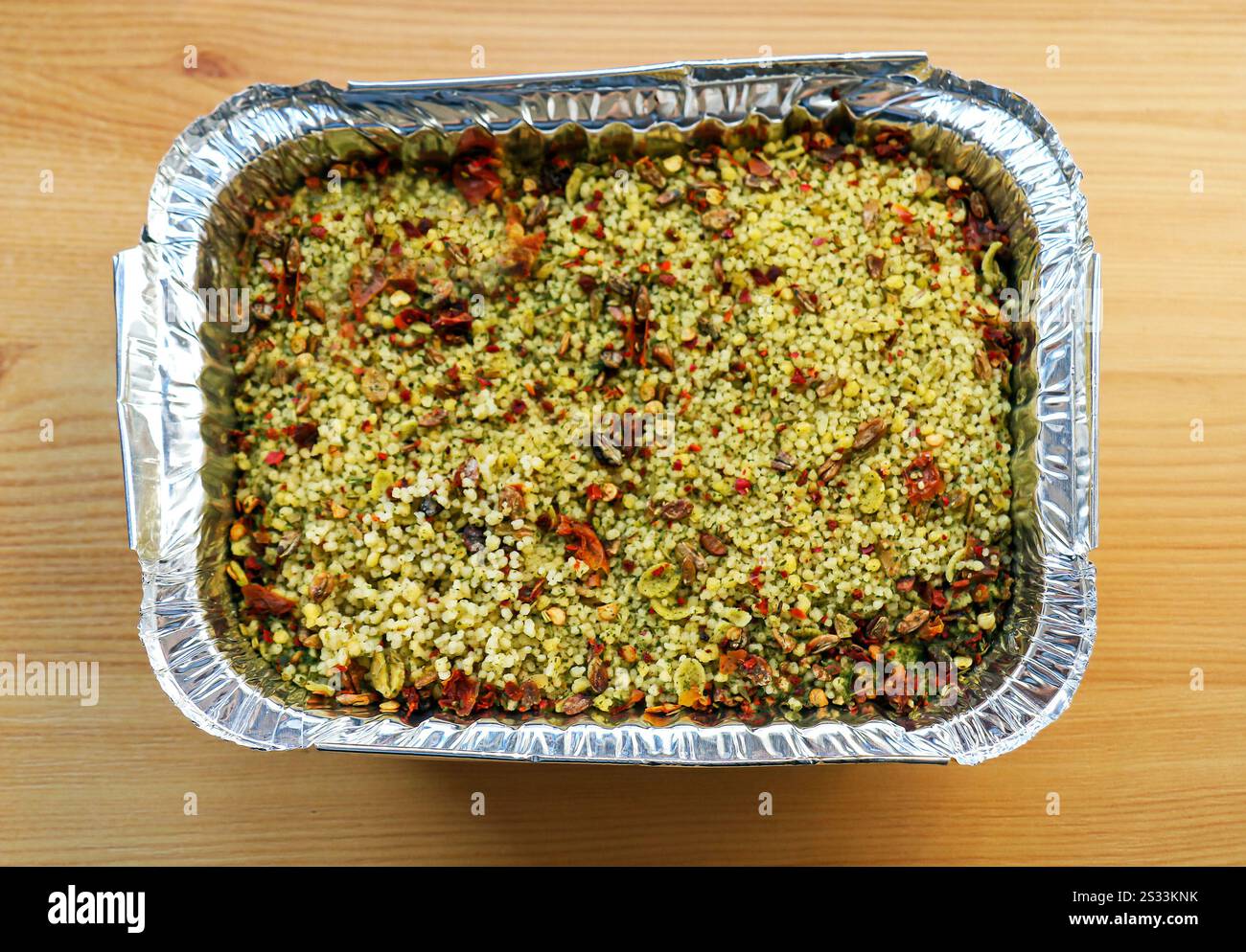Cooked couscous with vegetables inside metal foil box Stock Photo - Alamy