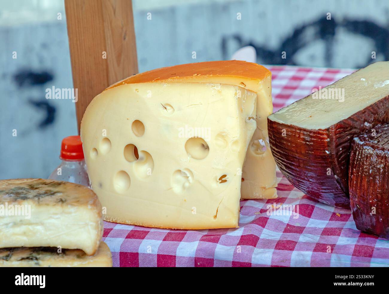 Emmentaler cheese with holes sold outside on a market stall Stock Photo ...