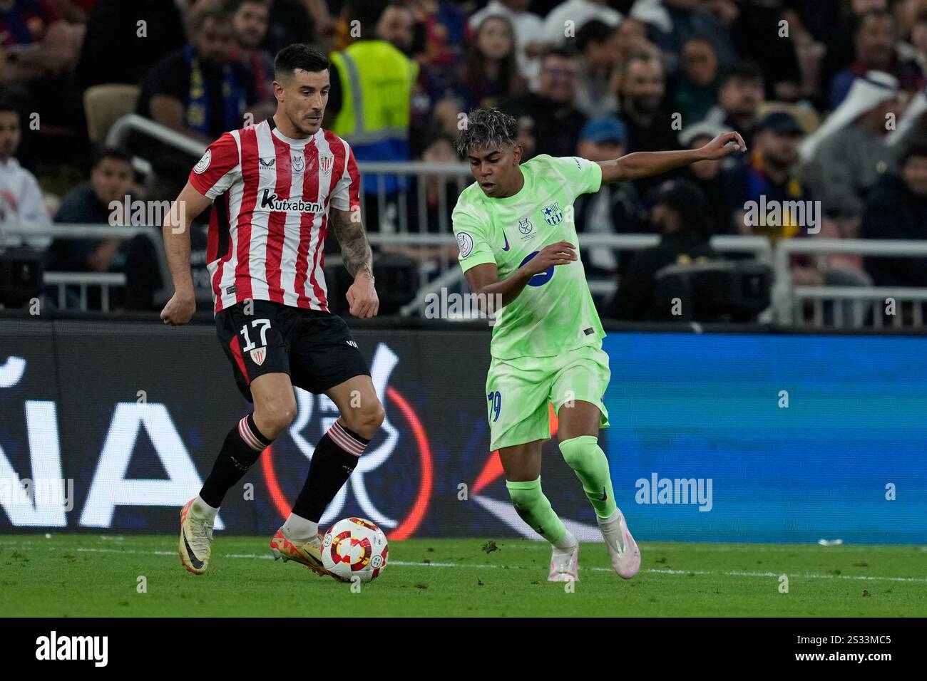 Athletic Bilbao's Yuri Berchiche, left, and Barcelona's Lamine Yamal ...