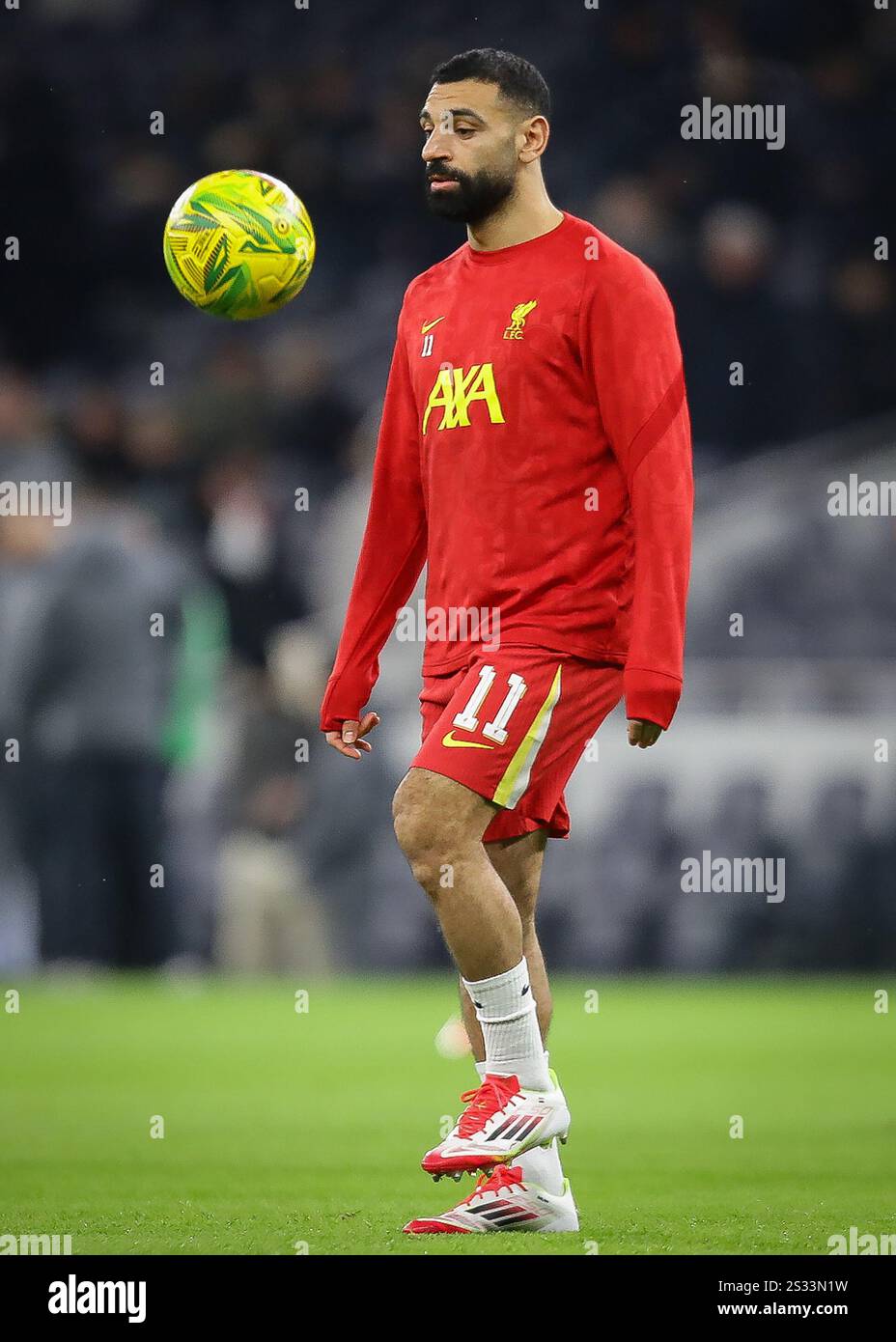 London, UK. 8th Jan, 2025. Liverpool forward Mohamed Salah (11) warming ...