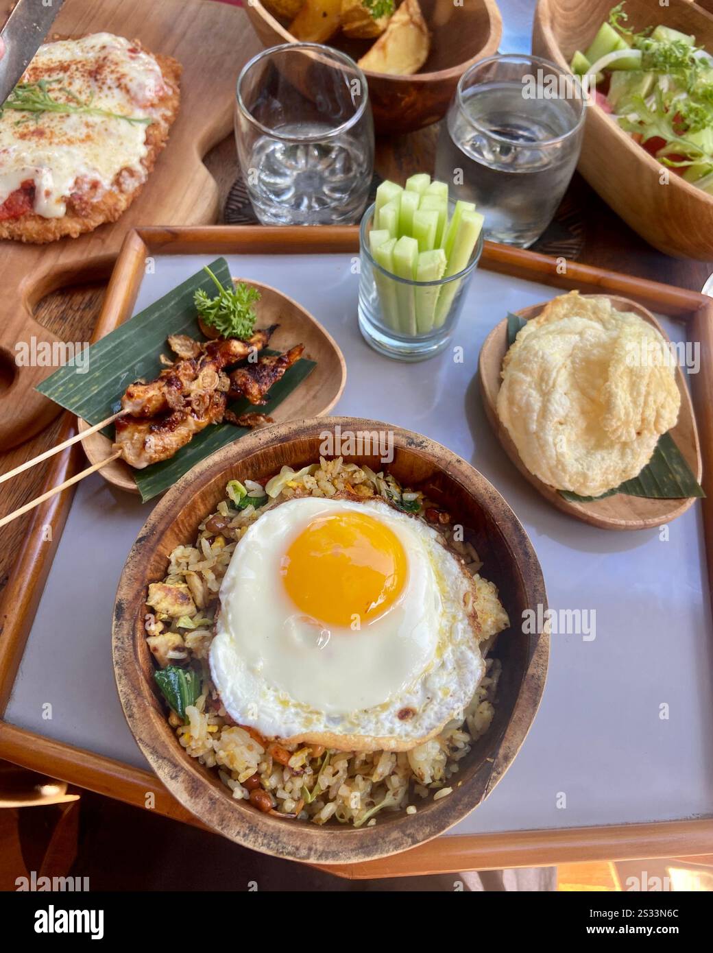 Traditional Balinese Cuisine Platter Featuring Nasi Goreng with Fried ...
