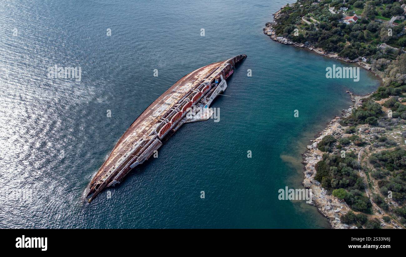 This is an aerial view showcasing a large ship peacefully floating ...