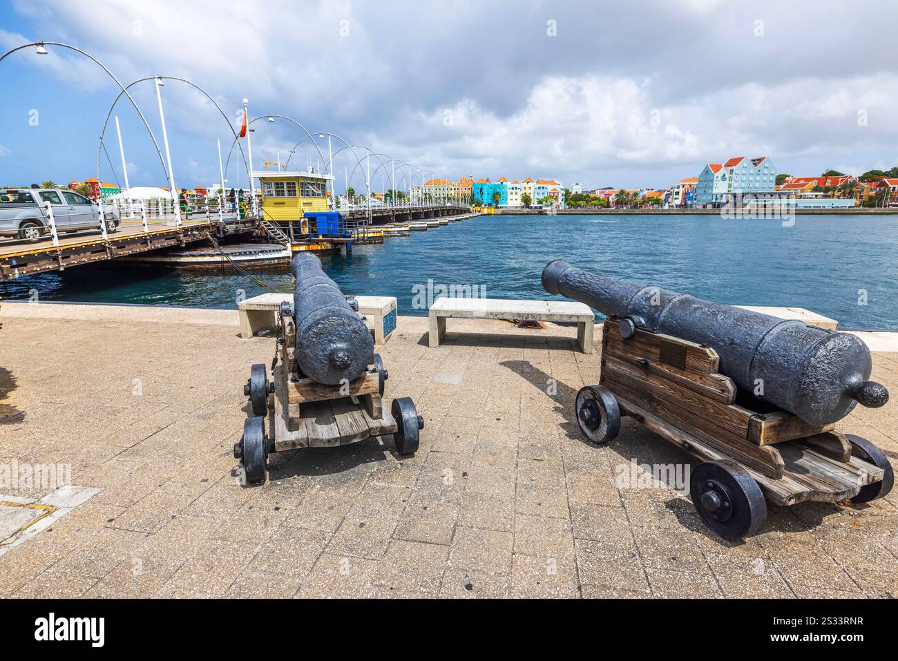Historic cannons overlooking Queen Emma Bridge in Willemstad, with ...
