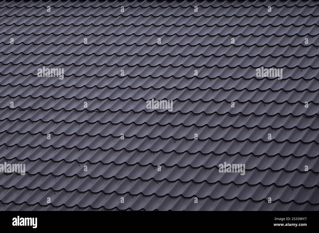 The texture of the roof of painted metal. Close-up detailed view of ...