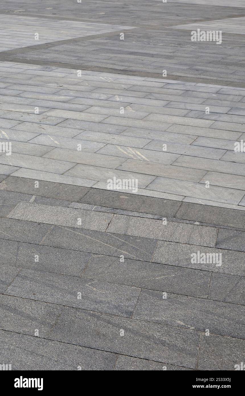 The texture of granite paving tiles from a variety of square shaped ...