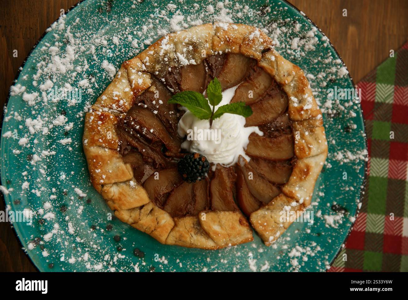 Cooking rustic pie, galette with pears and cinnamon. Top view, sweet ...