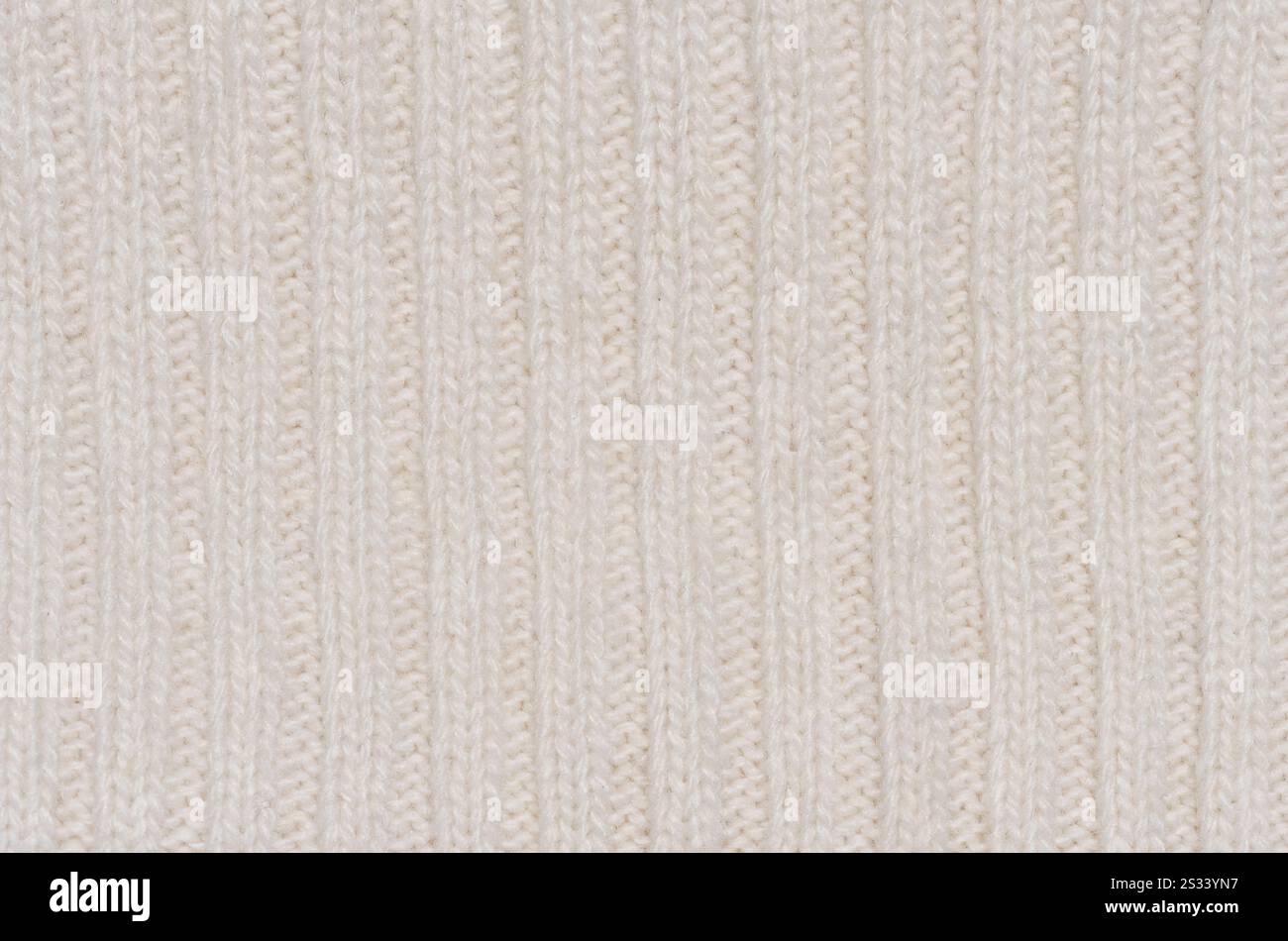 Knitted fabric made of white wool threads, pigtail pattern, full frame ...