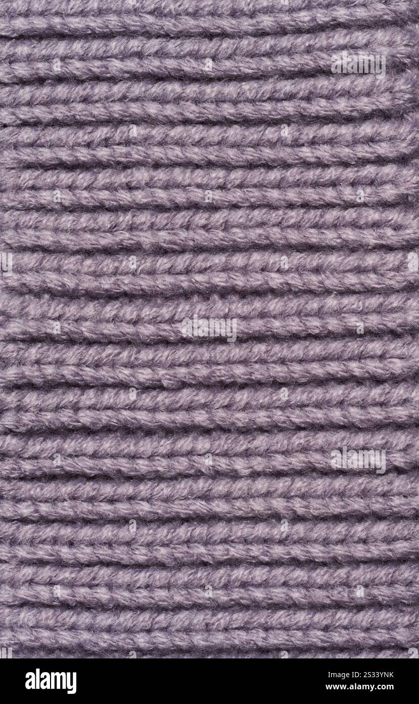 Knitted fabric made of purple wool threads, pigtail pattern, full frame ...