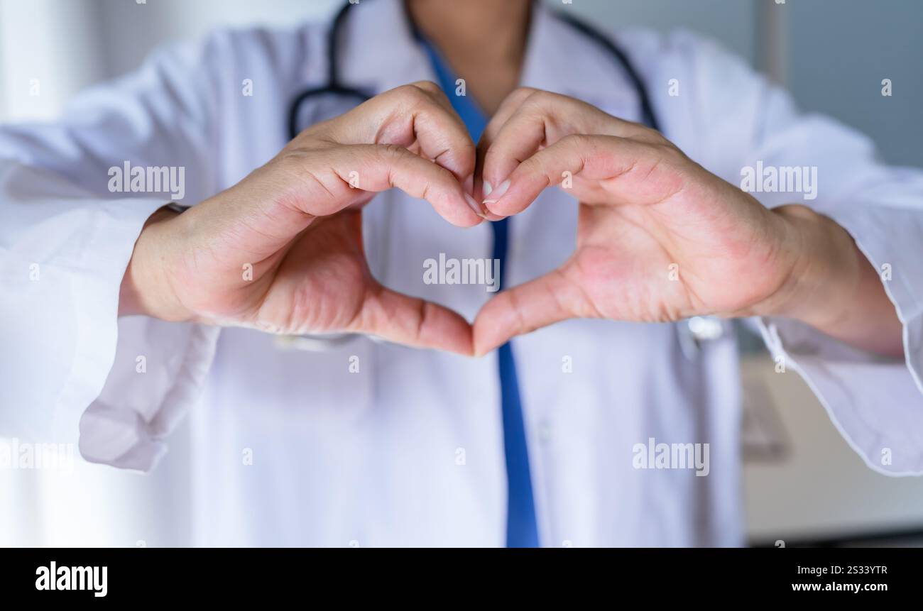 Doctor Cardiologist showing heart symbol with hand love and support to ...