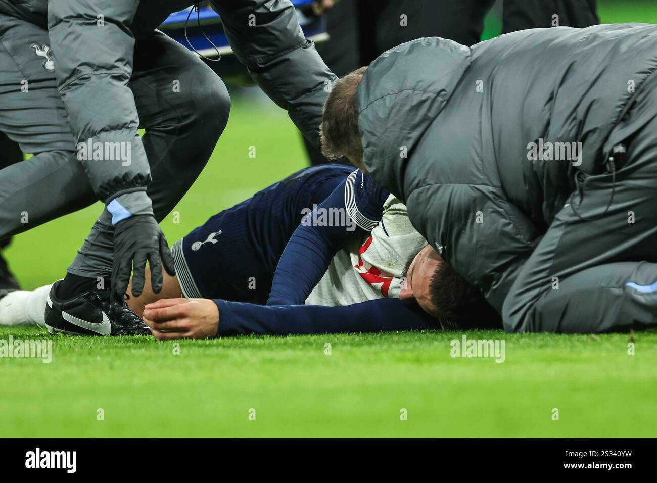 Rodrigo Bentancur of Tottenham Hotspur receives treatment during the Carabao Cup Semi-Finals ...