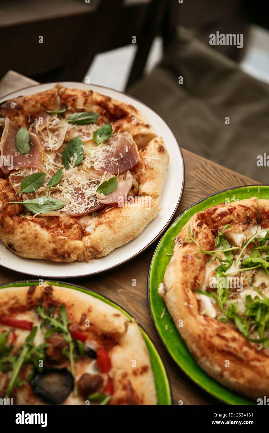 Delicious assortment of pizzas with various toppings, perfect for ...