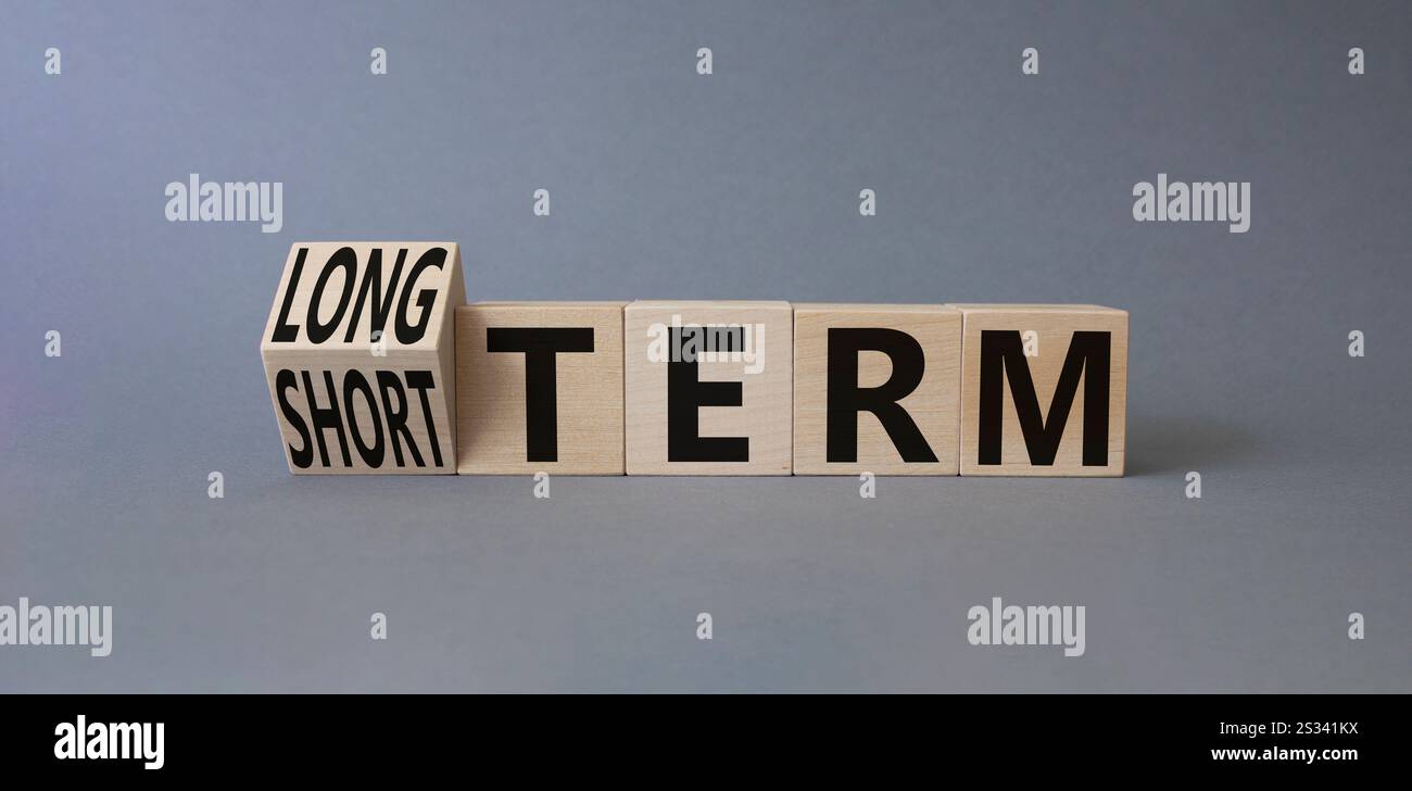 Long term vs Short Term symbol. Turned wooden cubes with words Long ...