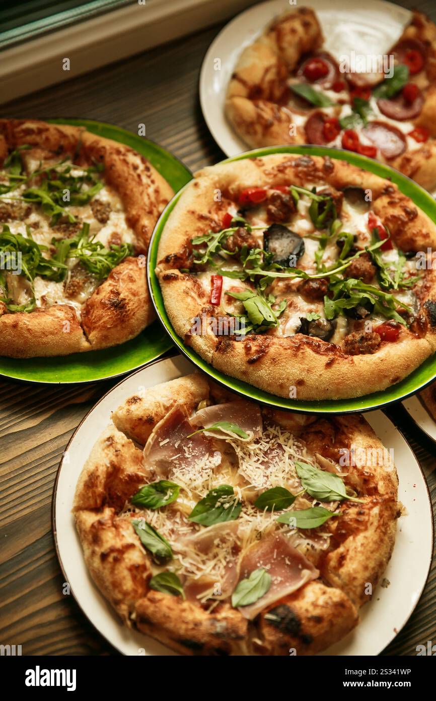Delicious assortment of pizzas with various toppings, perfect for ...