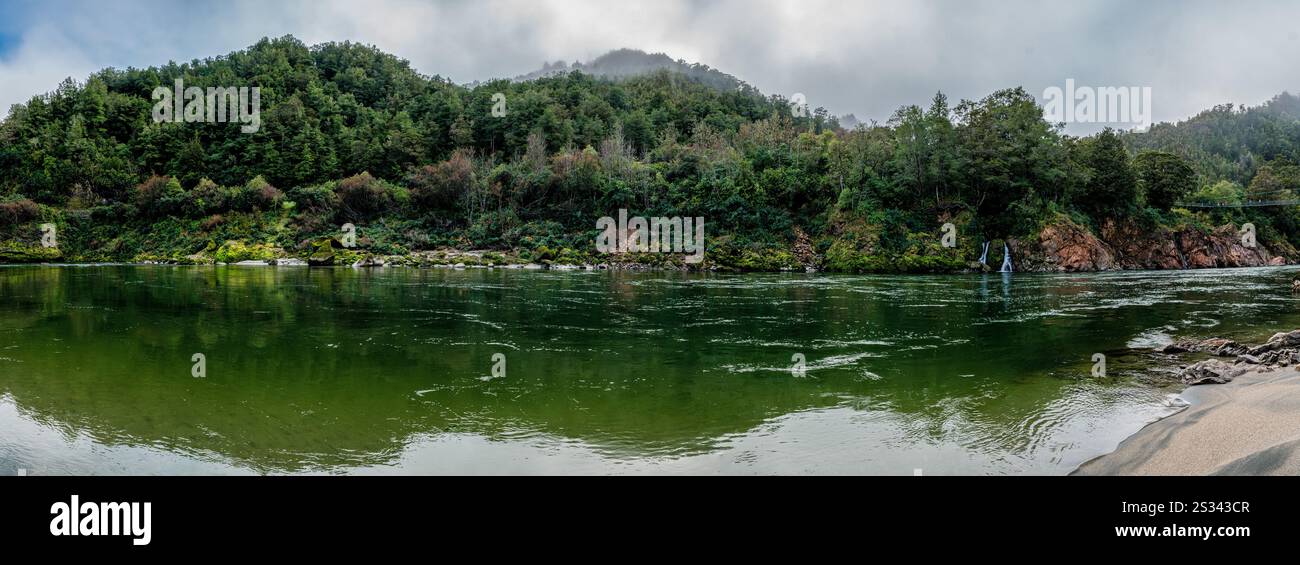 The Buller river flowing through the forest covered upper Buller Gorge ...