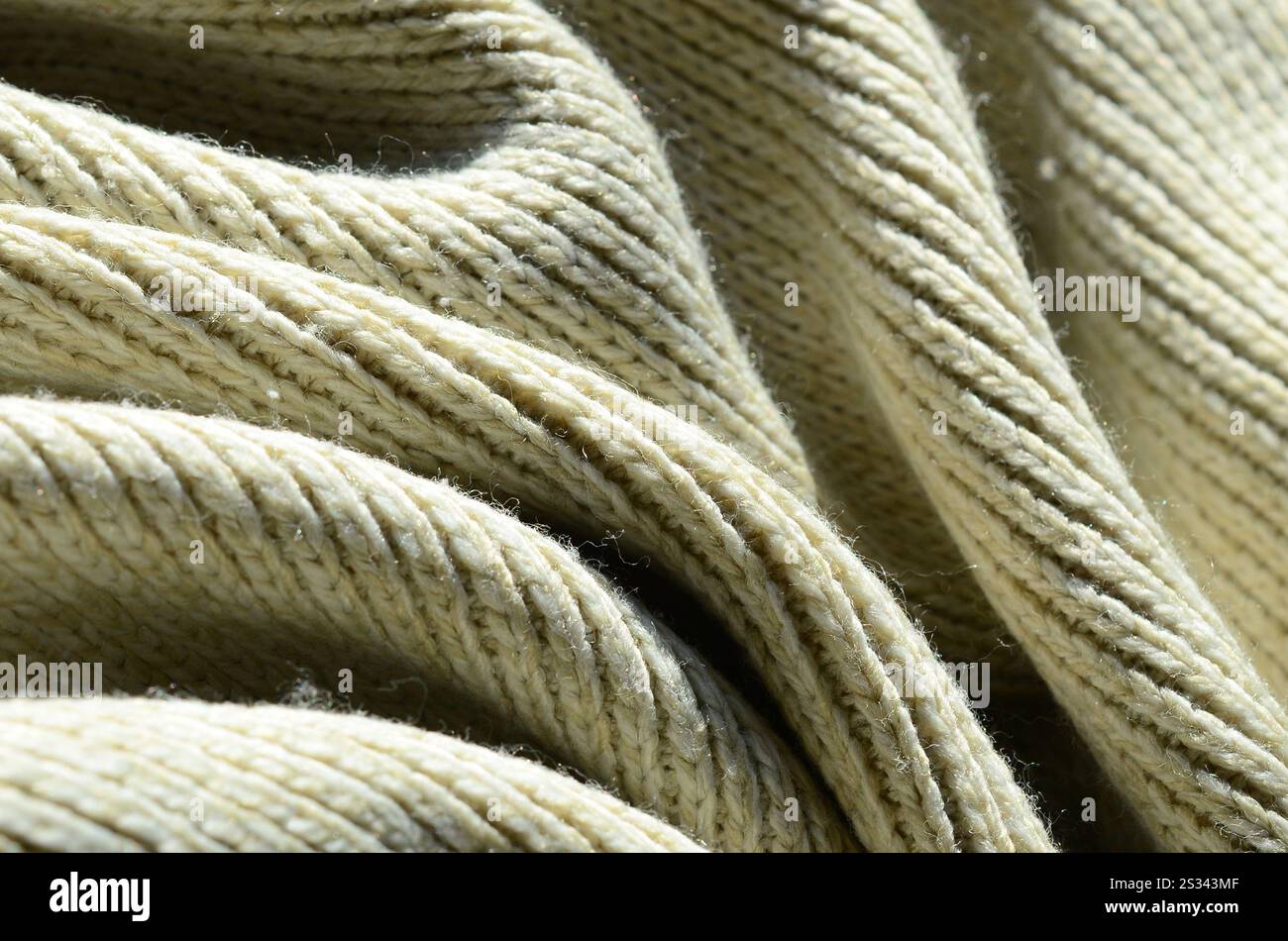 Fabric texture of a soft yellow knitted sweater. Macro image of the ...