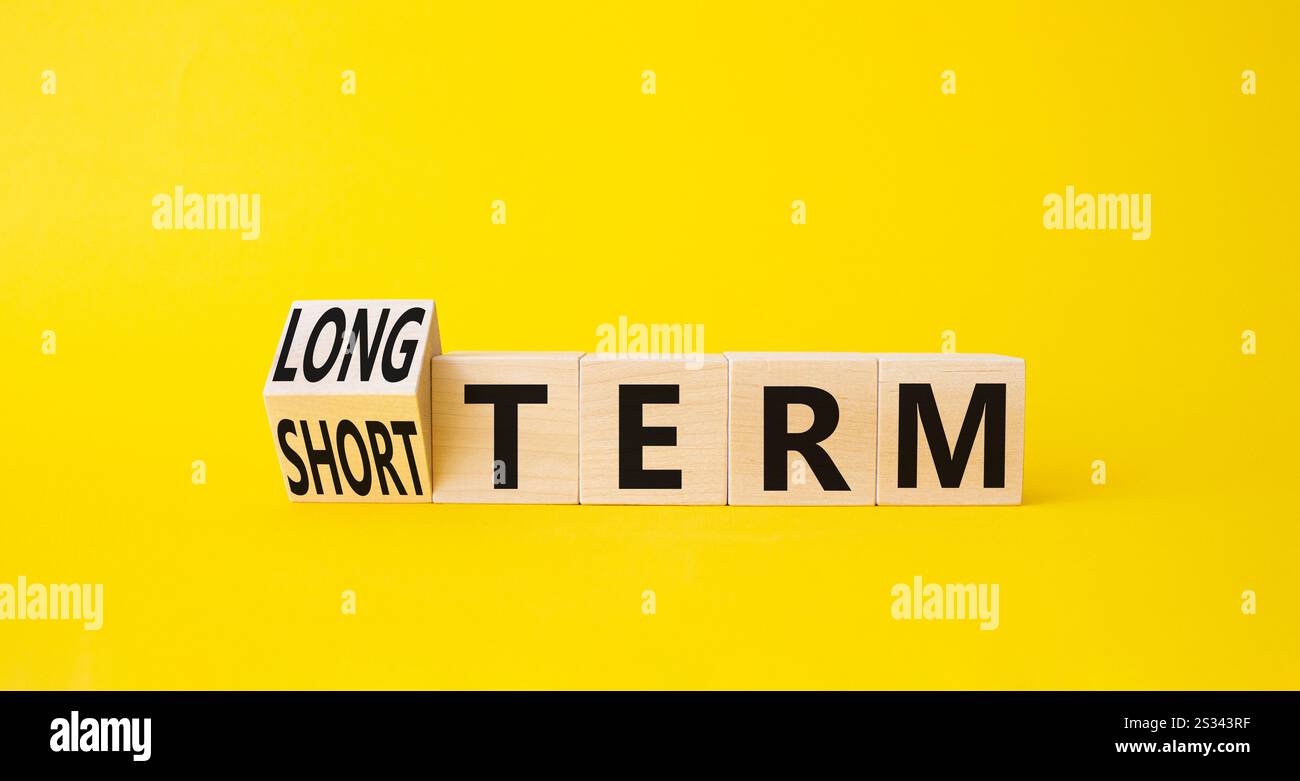 Long term vs Short Term symbol. Turned wooden cubes with words Long ...