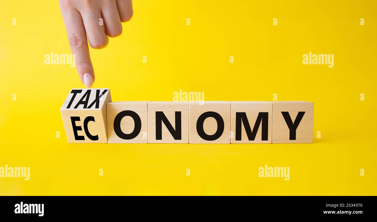 Taxonomy and economy symbol. Businessman hand points at Turned cubes ...