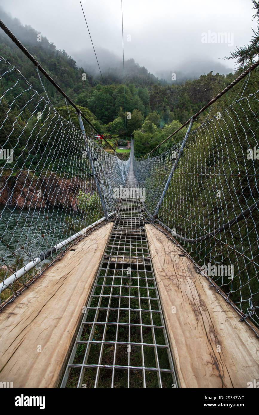 The Buller river flowing through the forest covered upper Buller Gorge ...