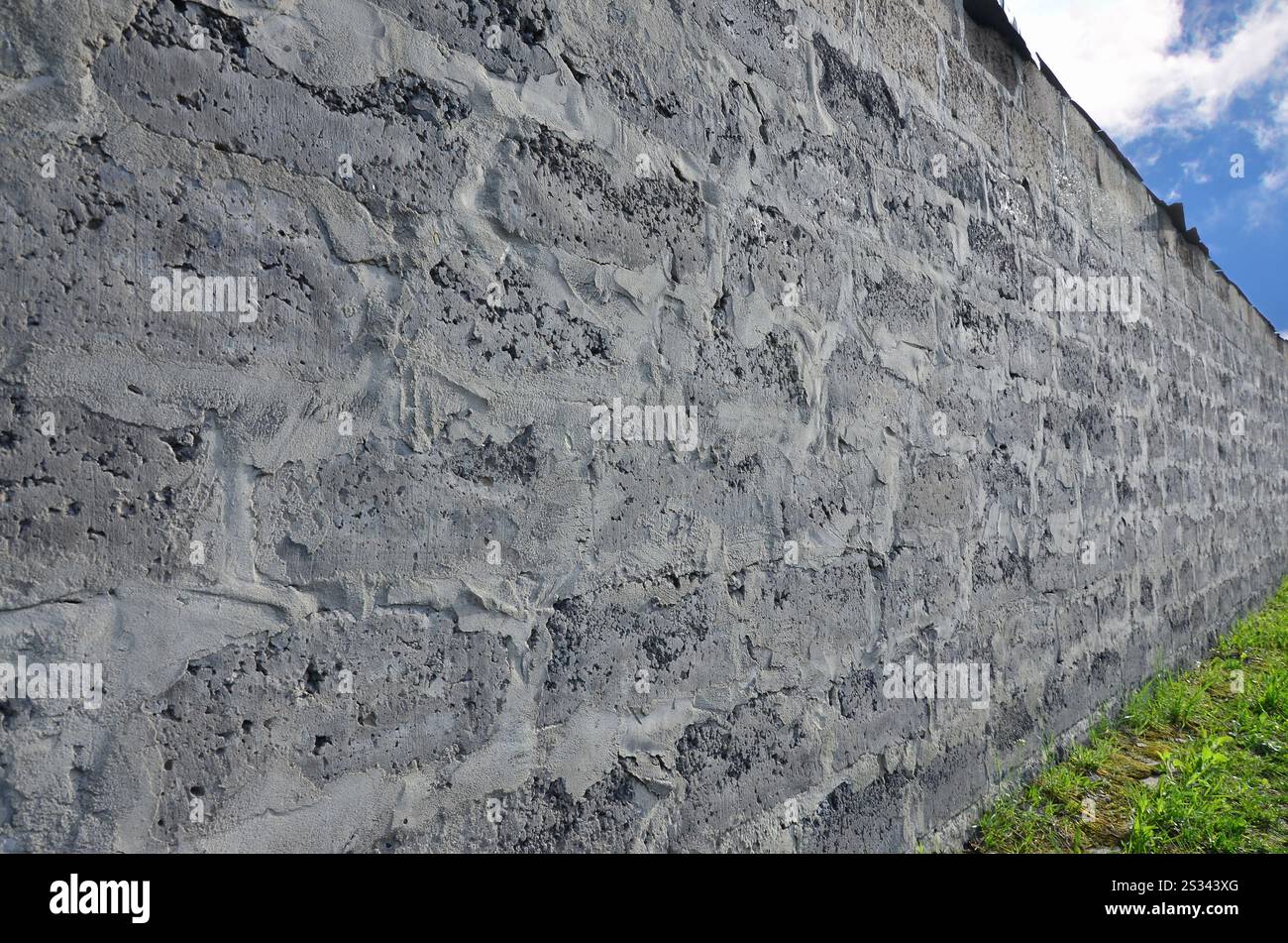 Weathered stained old grey block wall background. Texture of an old ...