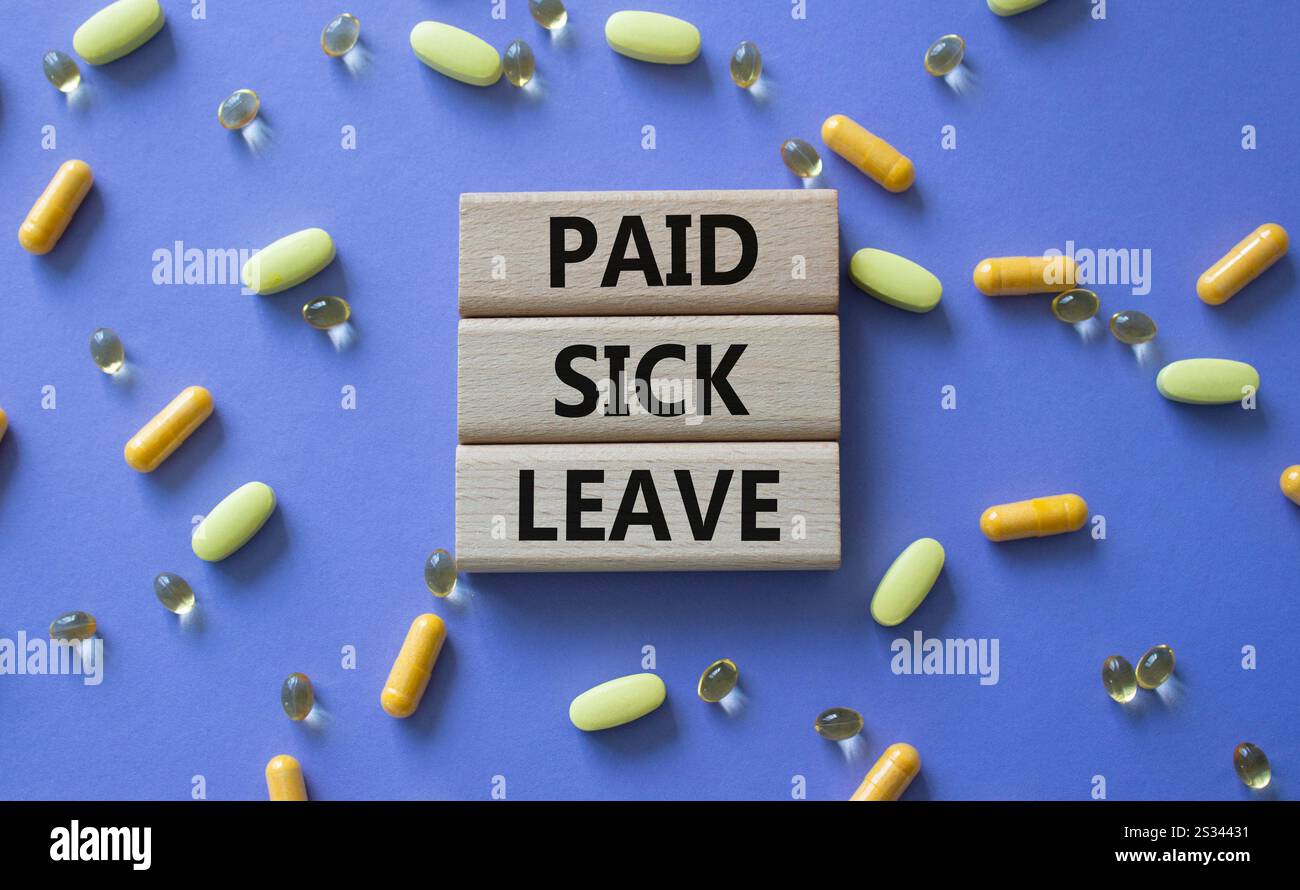 Paid Sick Leave symbol. Concept words Paid Sick Leave on wooden blocks ...