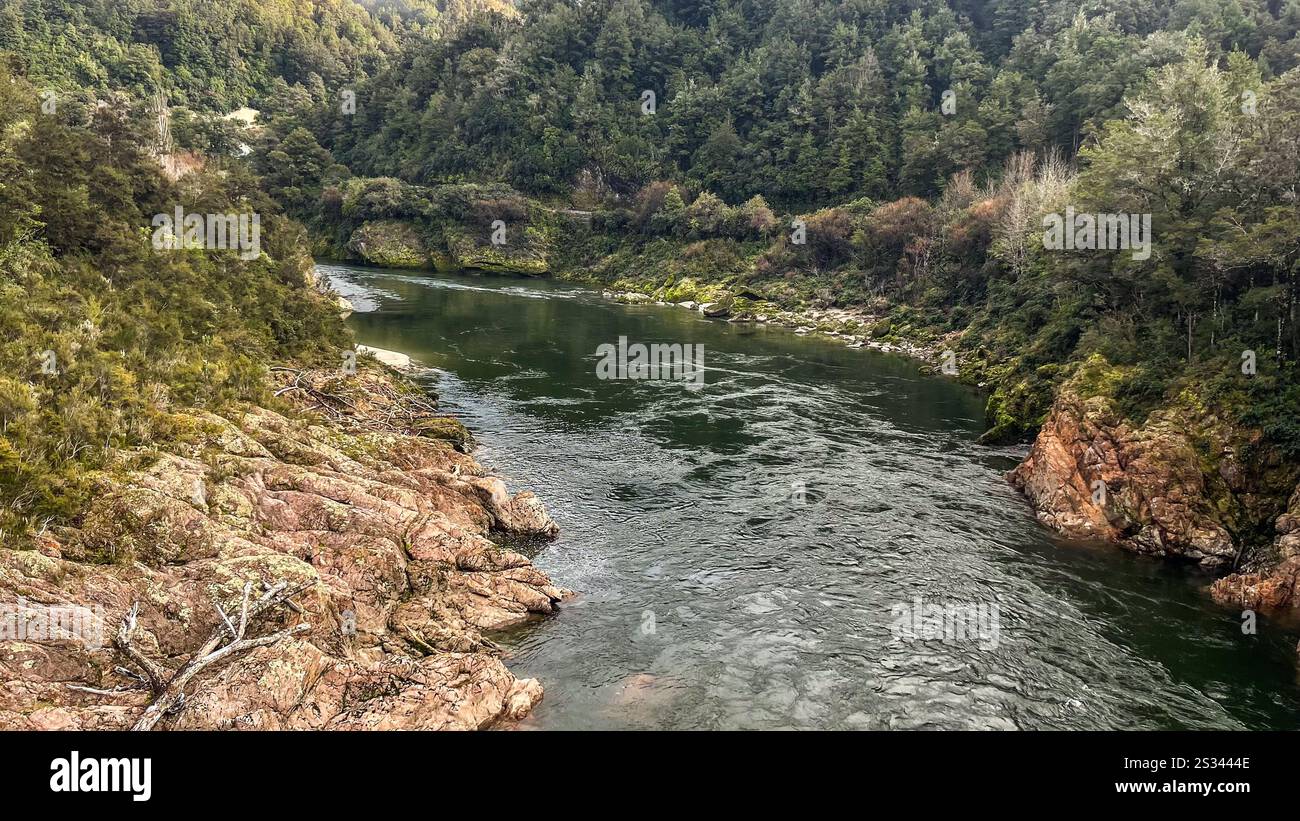 The Buller river flowing through the forest covered upper Buller Gorge ...