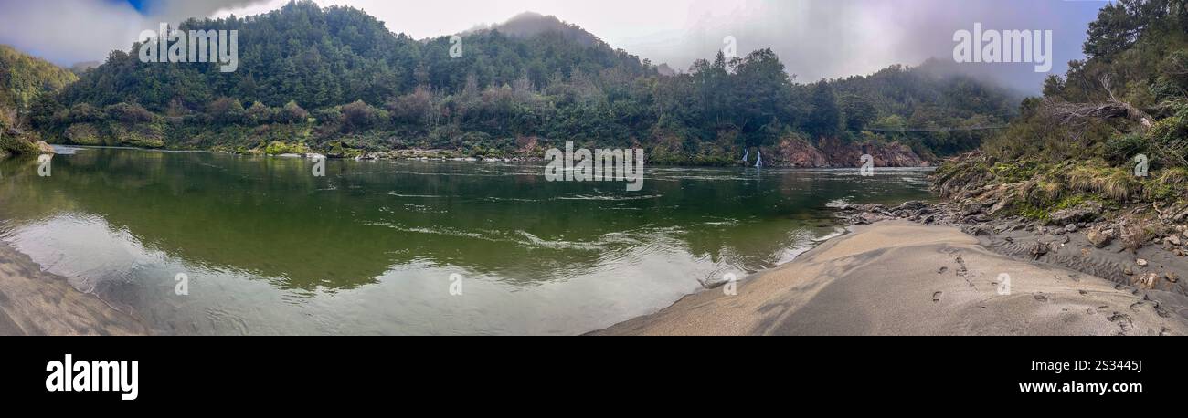 The Buller river flowing through the forest covered upper Buller Gorge ...