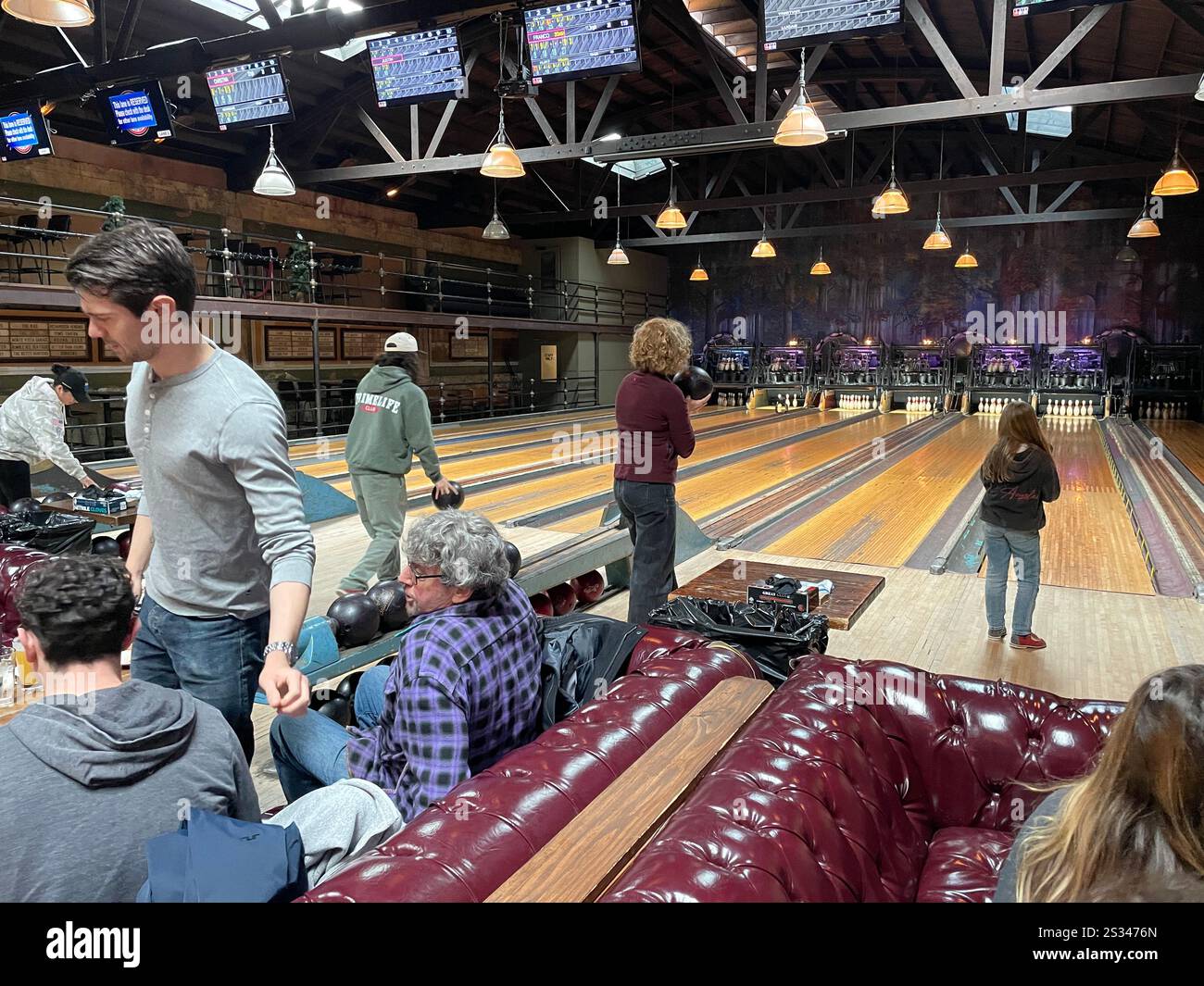 People bowling and having fun at the antique Highland Park Bowl bowling ...