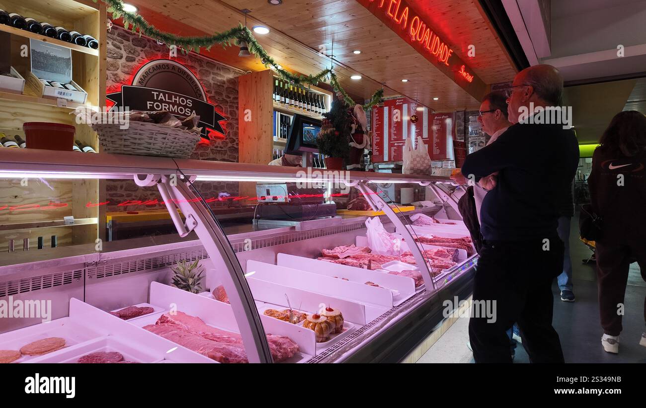 Local residents browse fresh produce inside the Faro Municipal Market ...