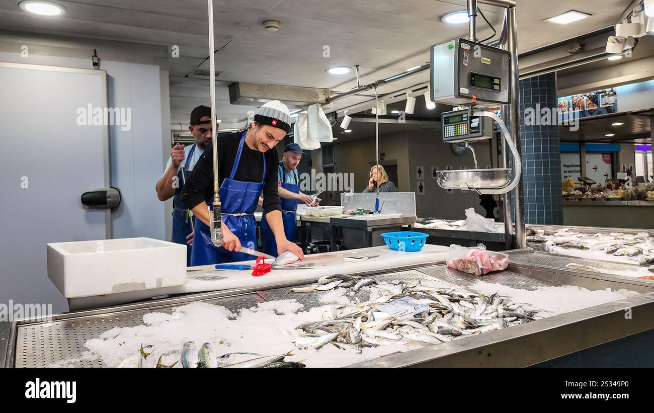 Local residents browse fresh produce inside the Faro Municipal Market ...