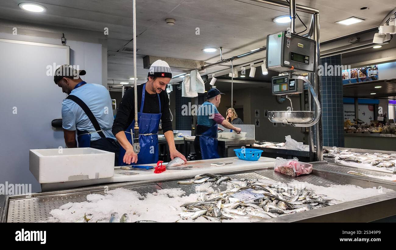 Local residents browse fresh produce inside the Faro Municipal Market ...