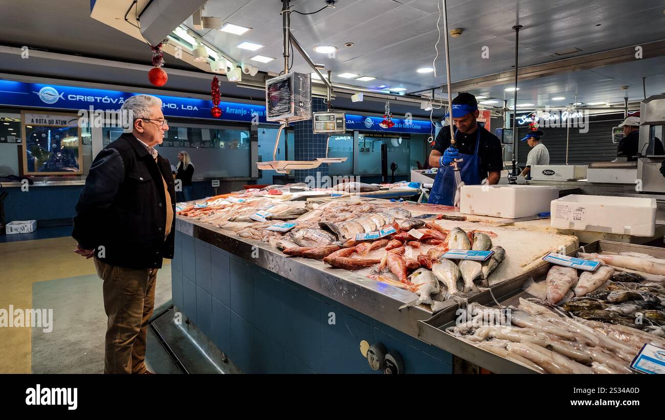 Local residents browse fresh produce inside the Faro Municipal Market ...
